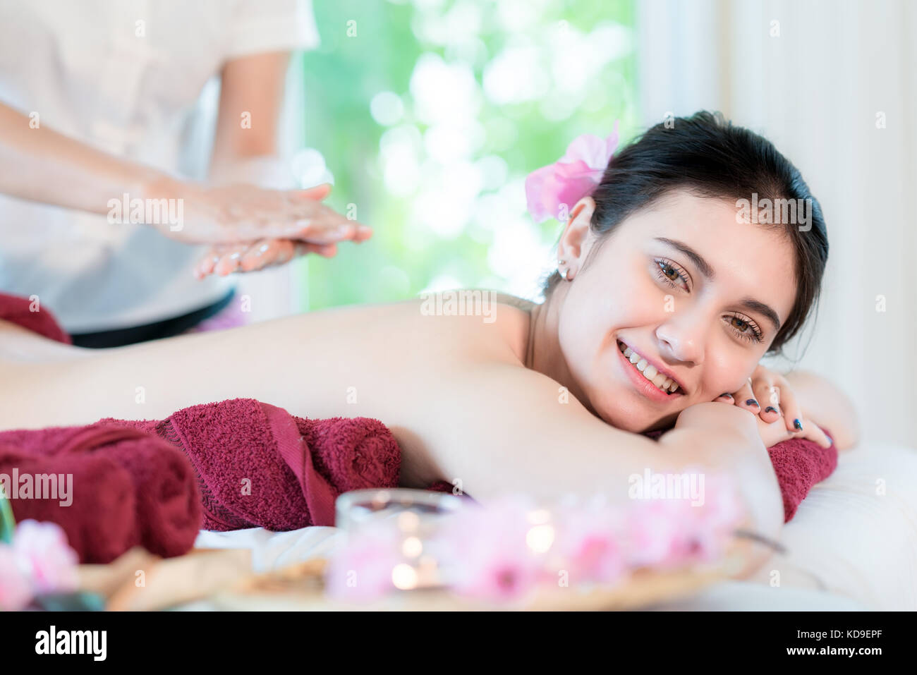 Yougn Asian woman relaxing with hand spa massage at beauty spa salon ...