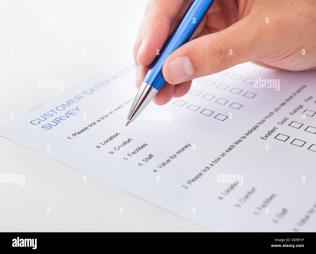Close-up Of A Person Filling Survey Form With Pen Stock Photo - Alamy