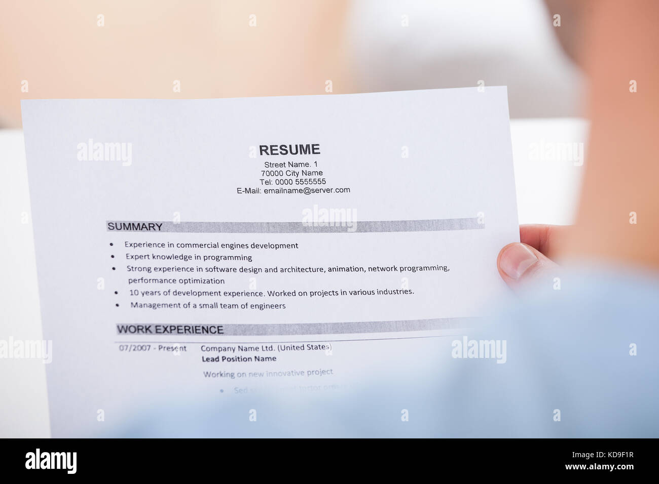 Close-up Person Holding Professional Resume In Hand Stock Photo - Alamy