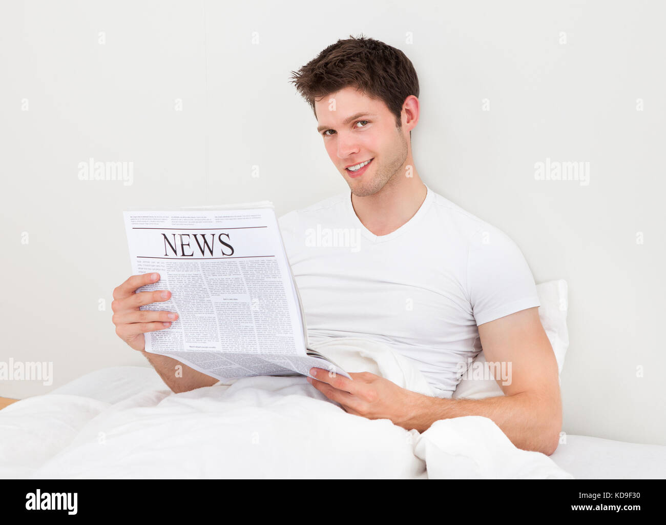 Boy reading newspaper hi-res stock photography and images - Alamy