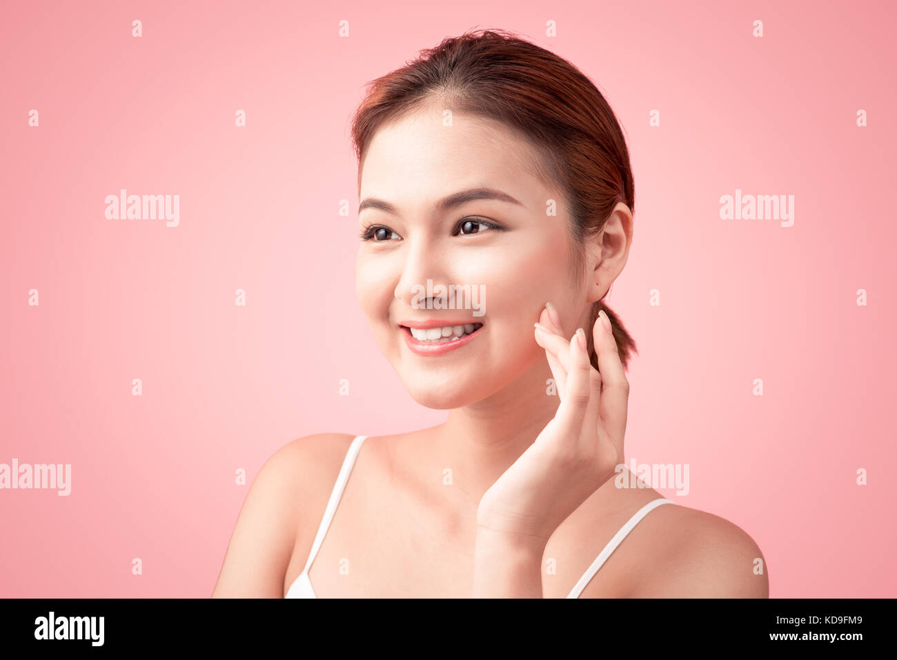 Portrait of Beautiful Skin care woman enjoy and relax touching her face ...