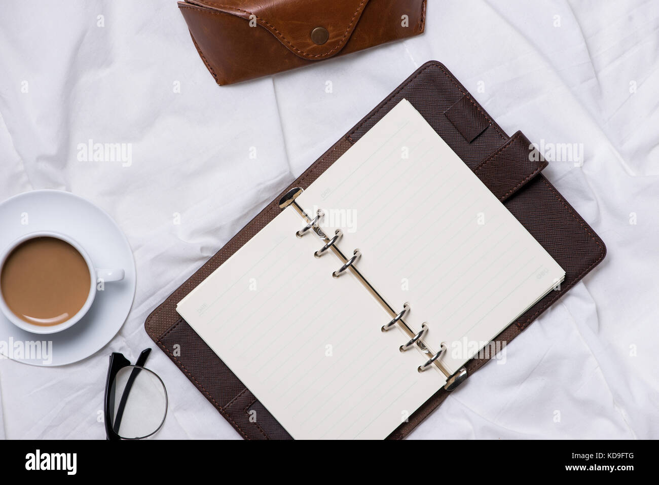 Morning Coffee and Diary with wooden pencil on cloth top view, woman ...