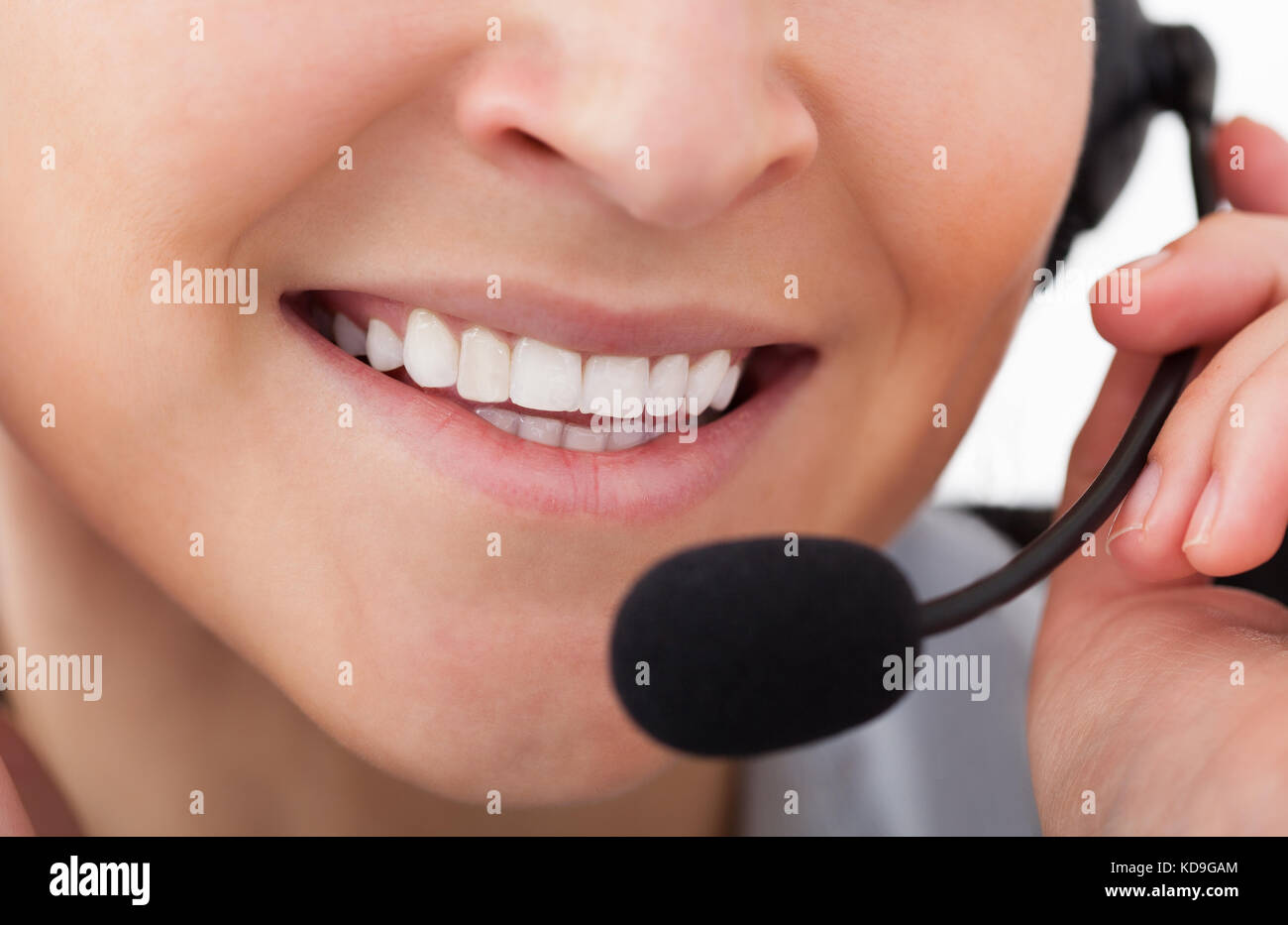 Portrait Of Happy Young Female Operator With Headphones Stock Photo - Alamy