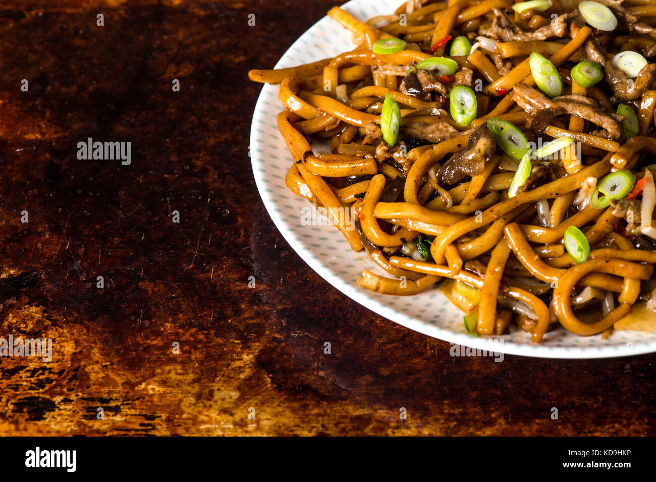 Oriental Shanghai Fried Beef Udon Noodles With Pak Choi Sitting on a ...