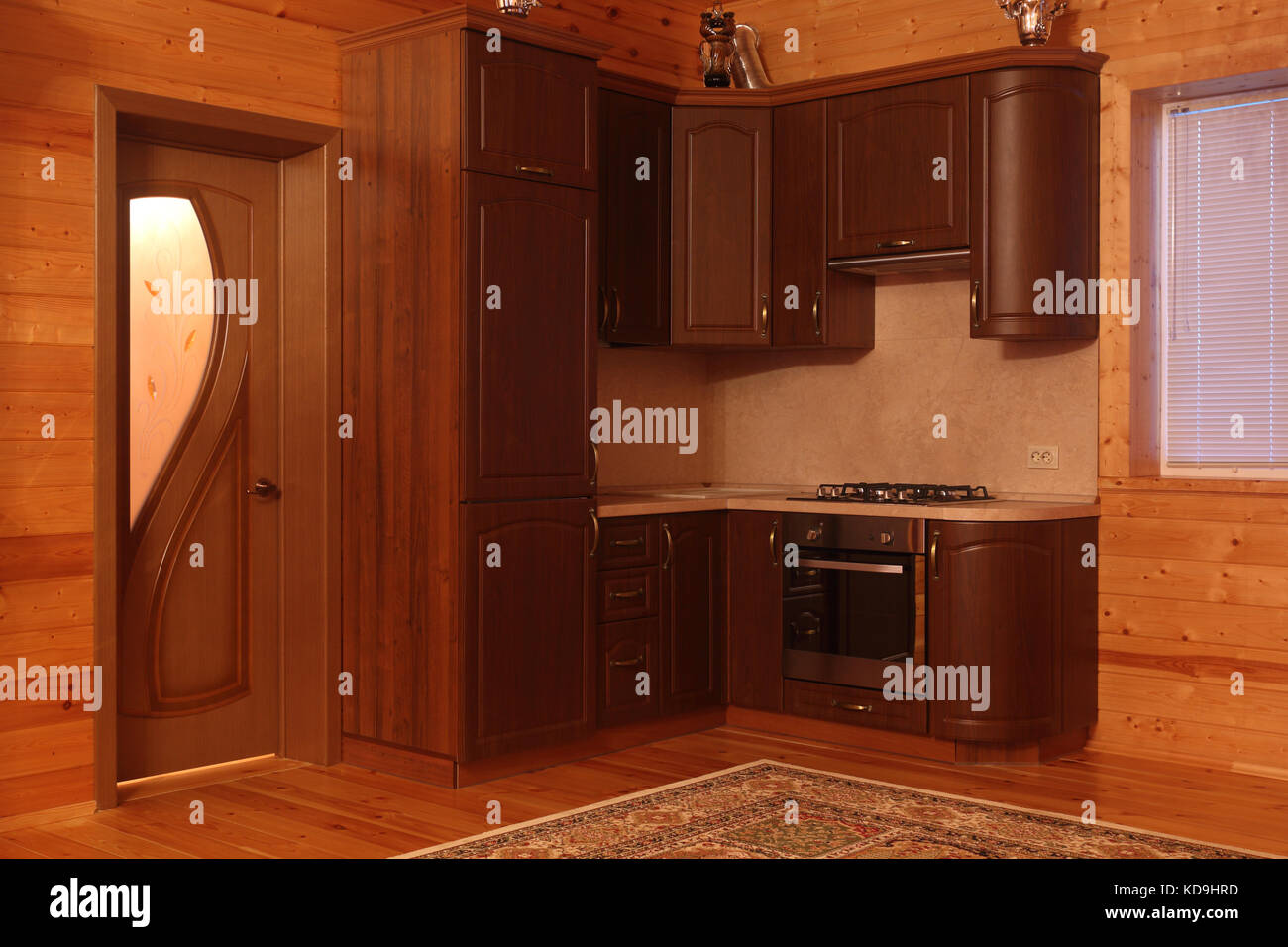 Wooden house interior with kitchen unit photo Stock Photo - Alamy