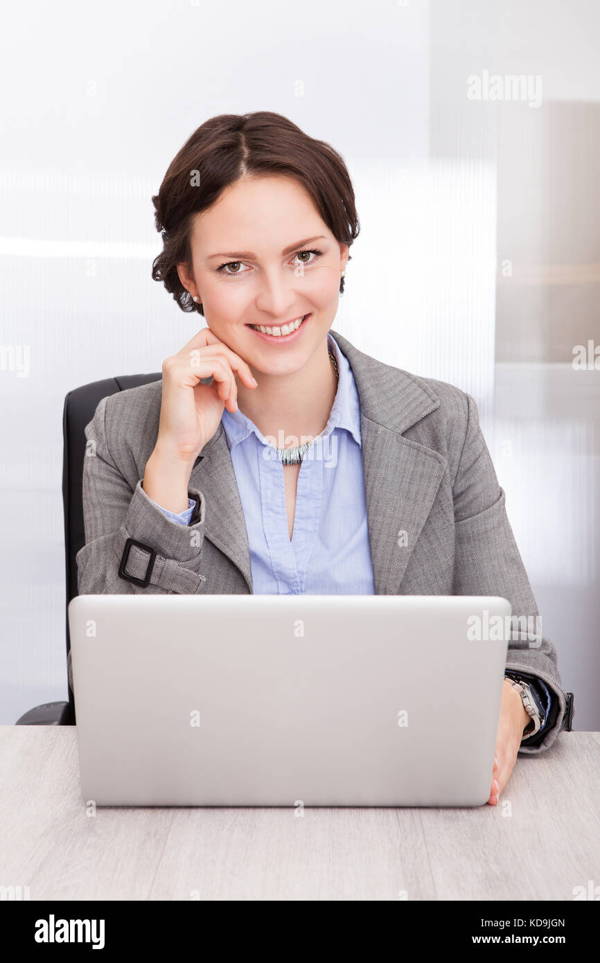 Woman reviewing data on laptop hi-res stock photography and images - Alamy