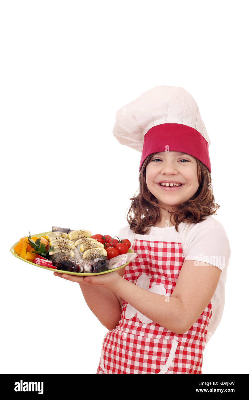 happy little girl cook with trout fish on plate Stock Photo - Alamy