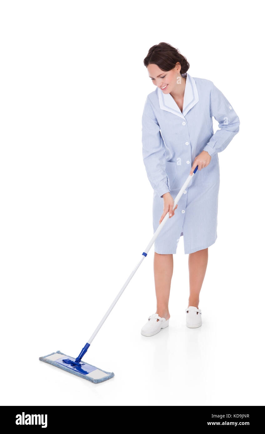 Happy Young Maid Holding Mop Over White Background Stock Photo - Alamy