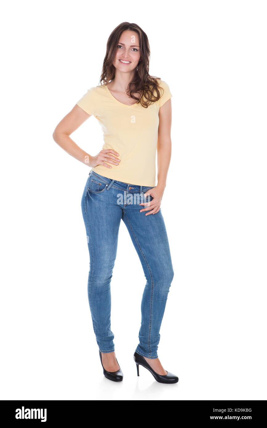 Smiling Attractive Young Woman With Hand In Pocket Stock Photo - Alamy