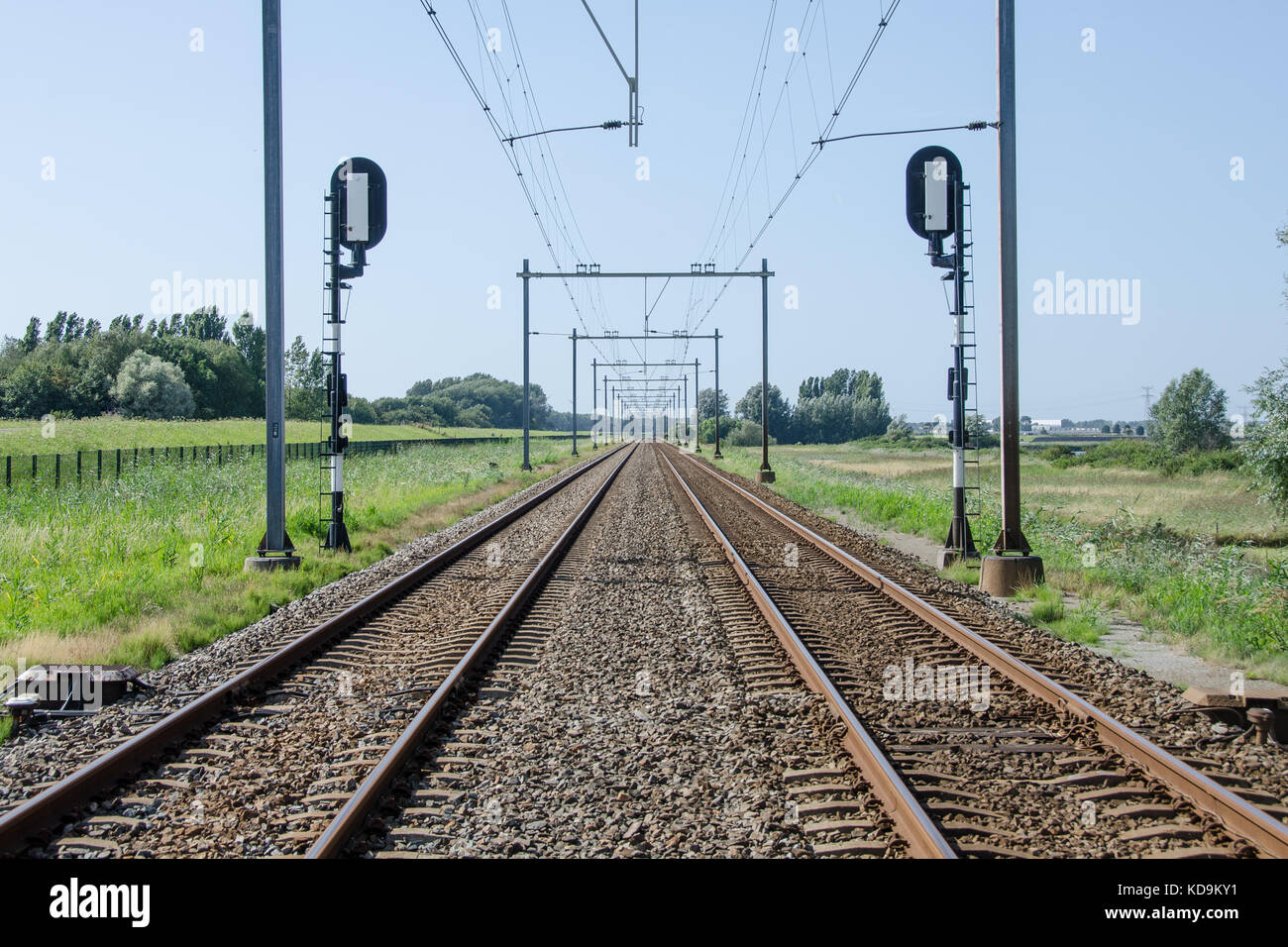 Railroad track to the horizon on a sunny day Stock Photo - Alamy