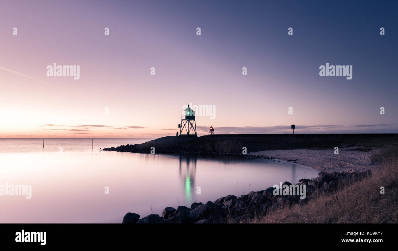 Lighthouse with sunset background Stock Photo - Alamy