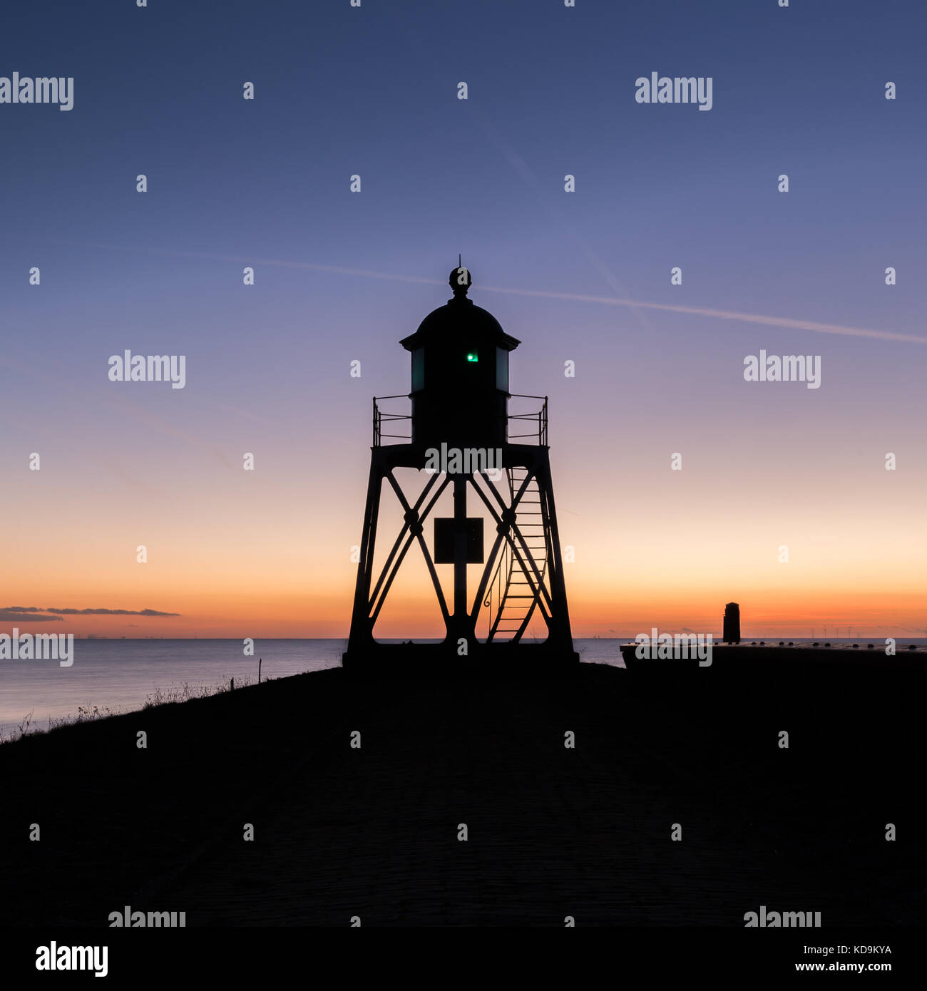 Lighthouse with sunset background Stock Photo - Alamy