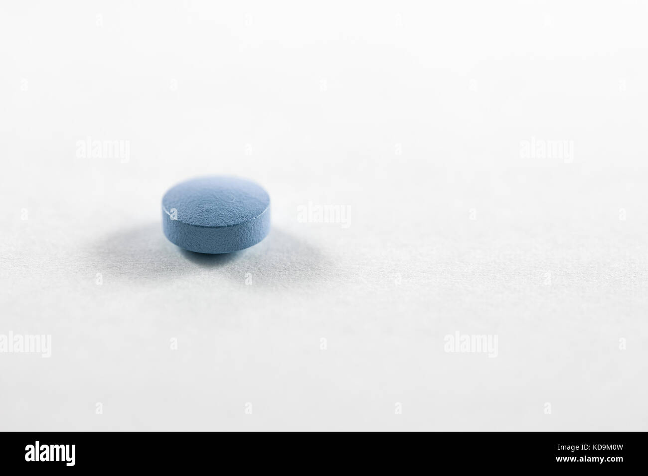 macro of a blue pill medicine Stock Photo - Alamy