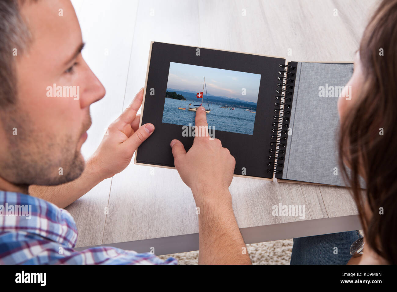 Mom and girl look at photo album hi-res stock photography and images ...