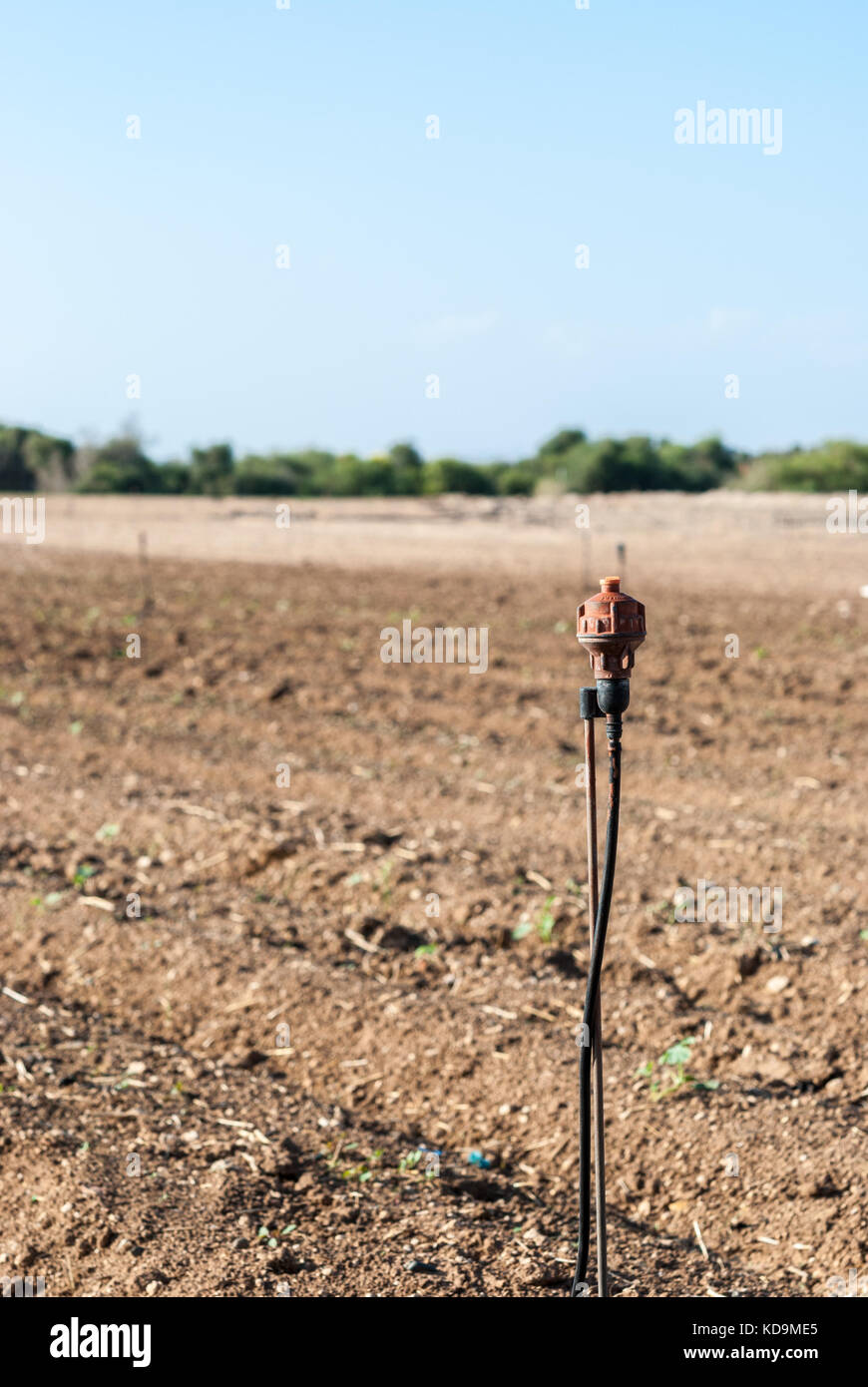 Sprinkler field irrigation system on agricultural land Stock Photo - Alamy