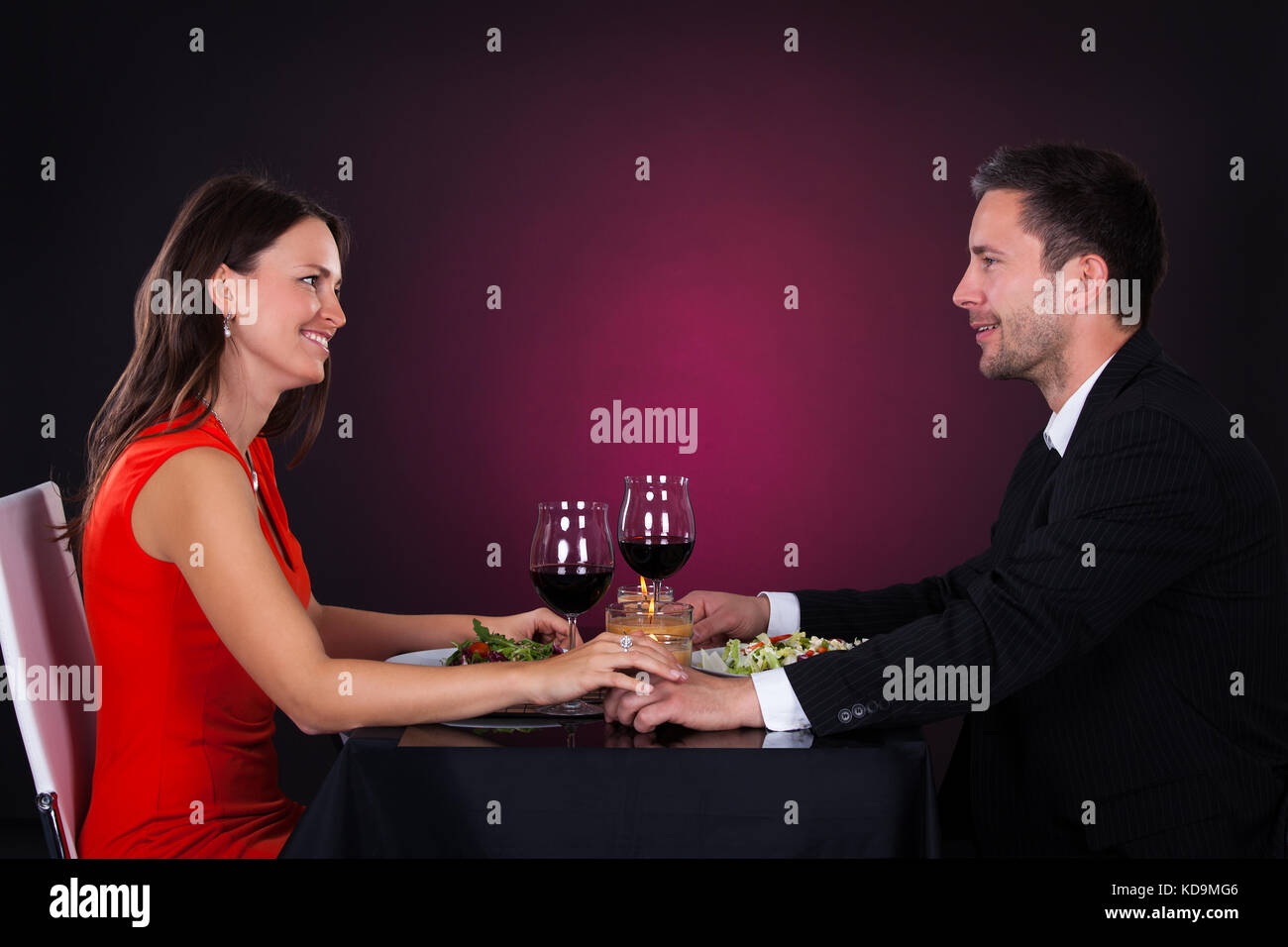 Young Smiling Couple Having Dinner With Wine Glass On Table Stock Photo ...