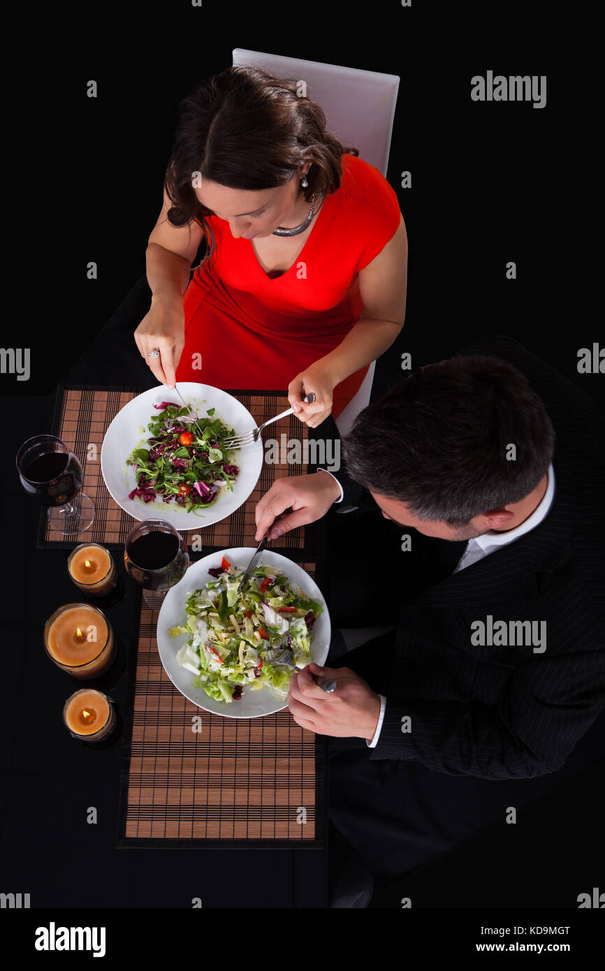 Overhead View Of Couple Eating Food At Restaurant Stock Photo - Alamy