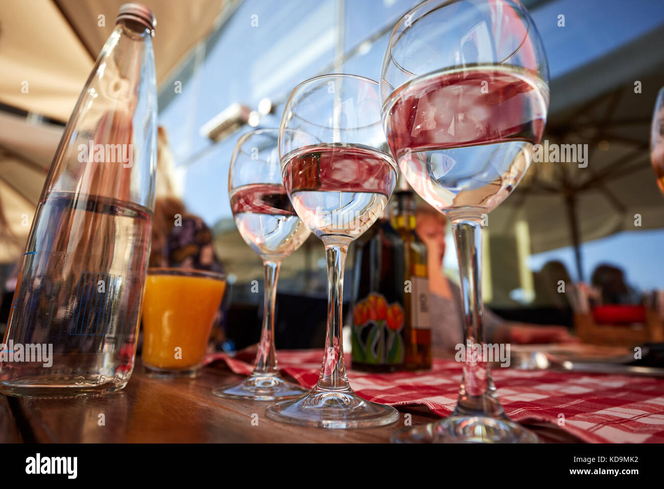Row of pure drinking water glasses at summer terrace cafe Stock Photo ...