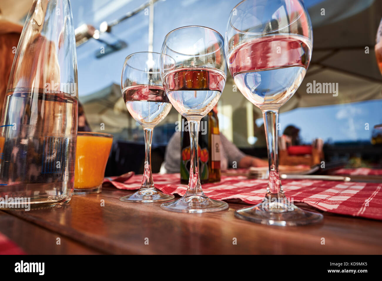 Row of pure drinking water glasses at summer terrace cafe Stock Photo ...