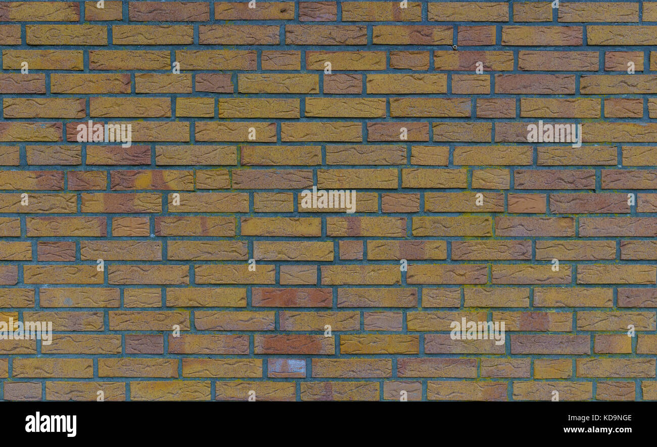 Background of yellow brick wall texture alone Stock Photo - Alamy