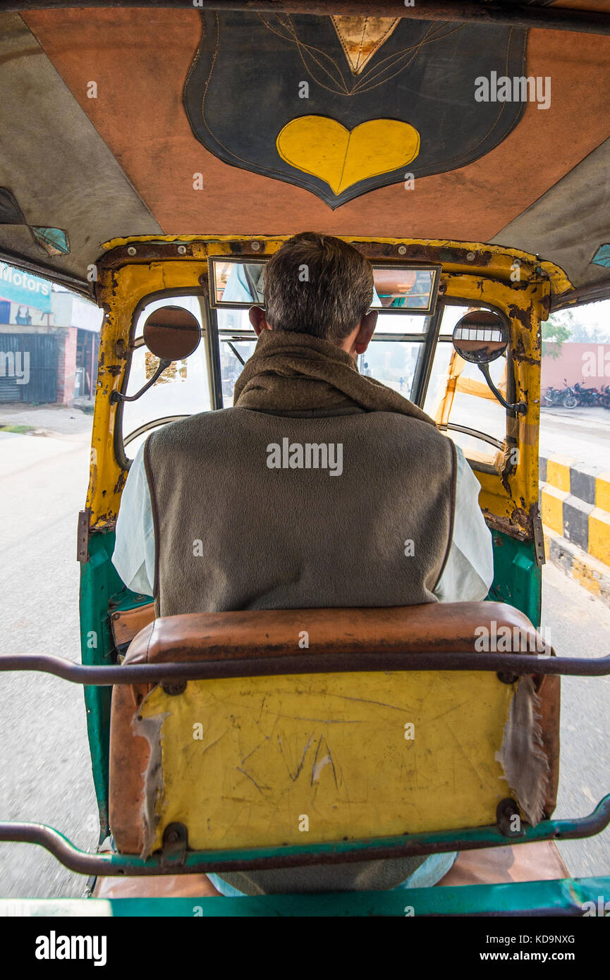 AGRA - INDIA DECEMBER 6 2017. A rickshaw (also known as Tuc Tuc) driver ...