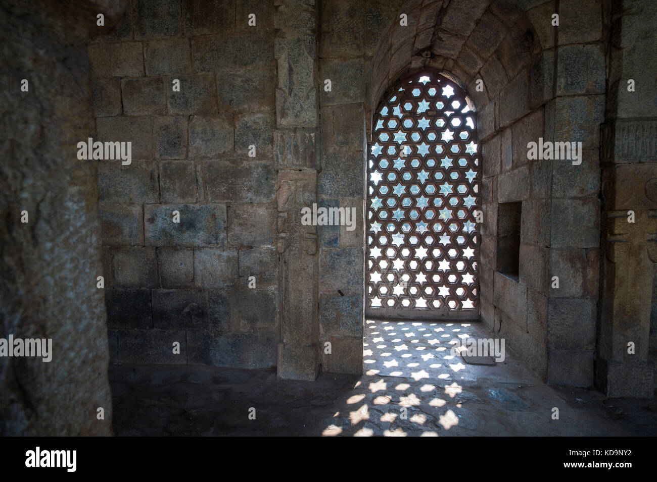 Some rays of sunshine pass through a door inside the Qutub Minar ...
