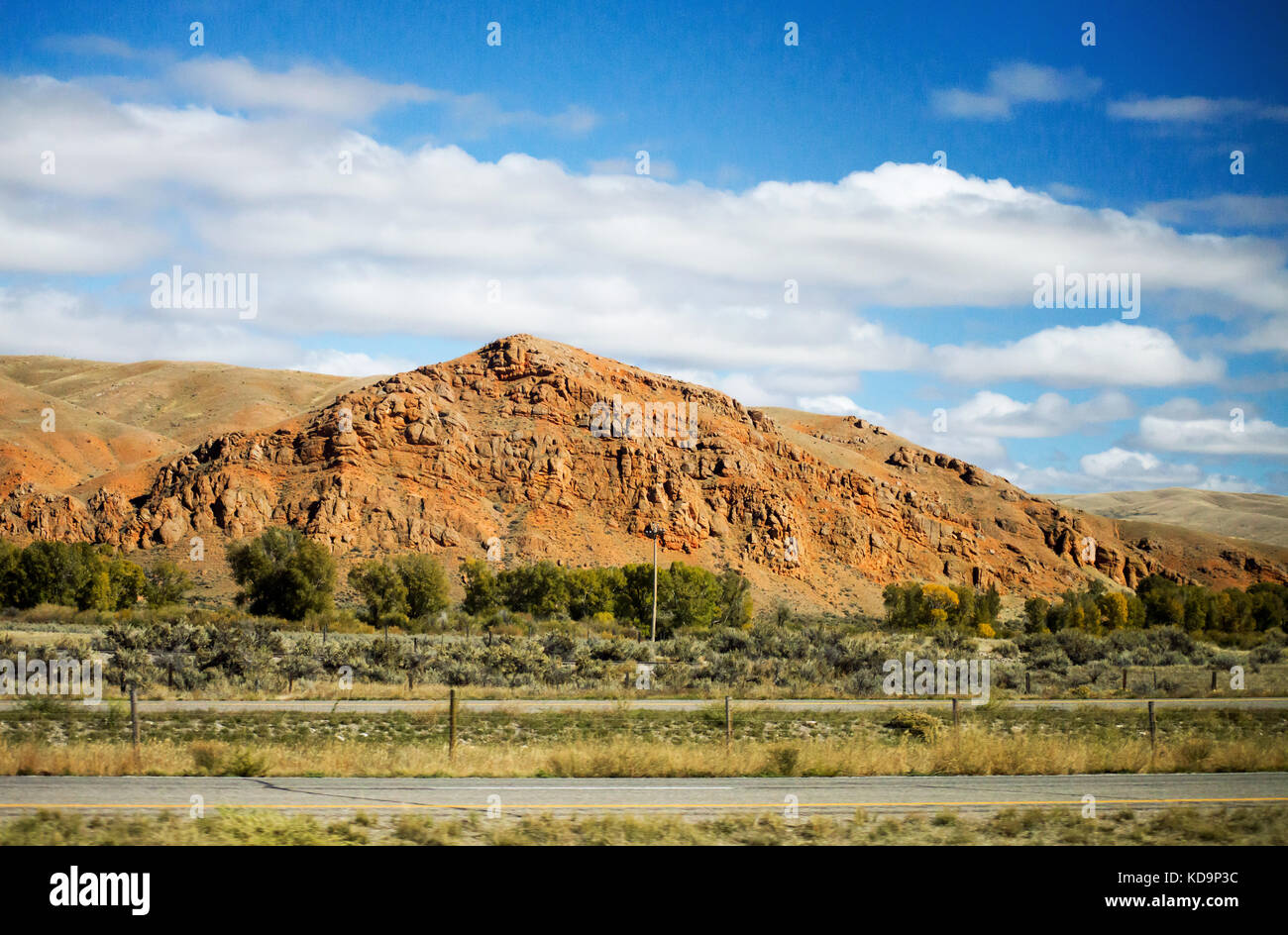 A tan rock formation on a bright blue sky Stock Photo - Alamy