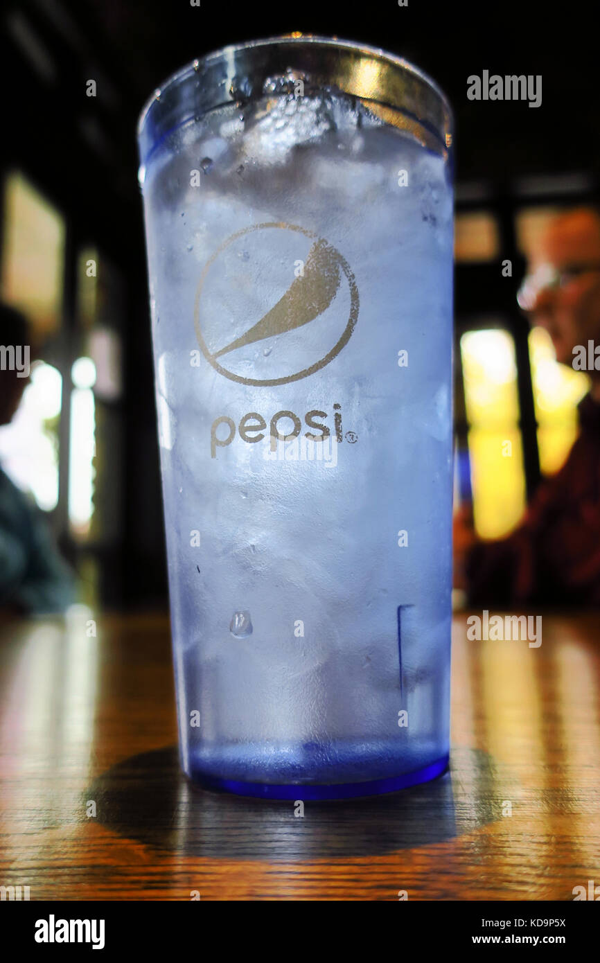 A pepsi glass with ice cold water on a table in a bar Stock Photo - Alamy