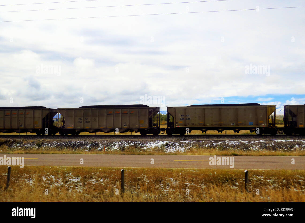 A coal cargo train passing through a field in Montana Stock Photo - Alamy