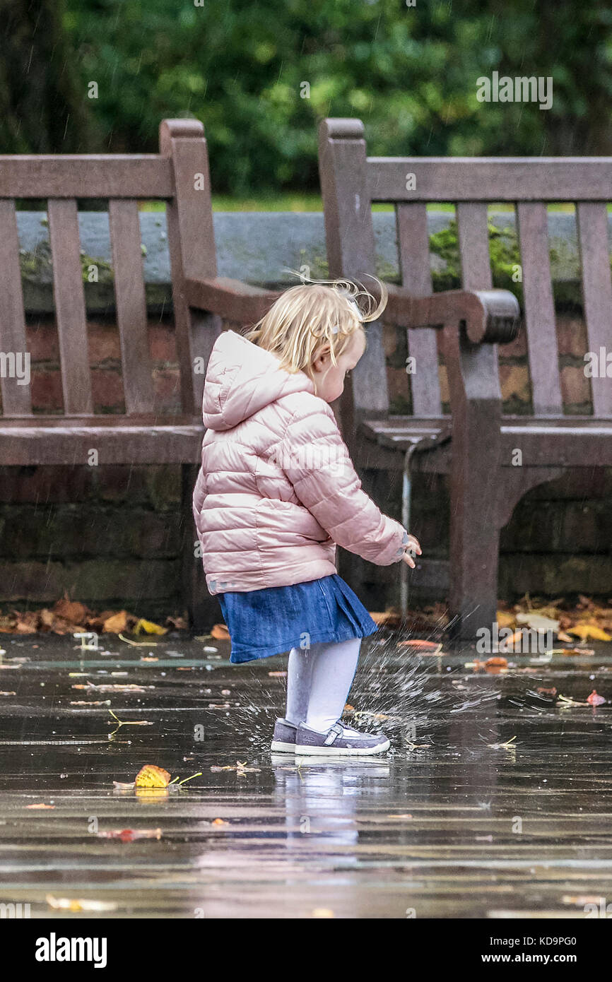 Kid splashing small puddle hi-res stock photography and images - Alamy