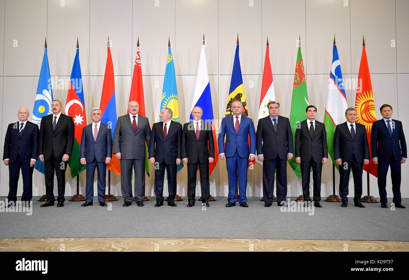 Russian President Vladimir Putin, center, stands with leaders of the ...