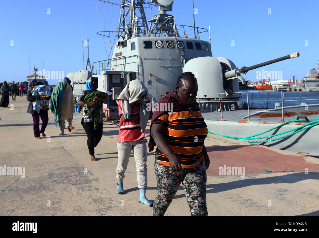 Tripoli, Libya. 11th Oct, 2017. Immigrants arrive at a naval base after ...