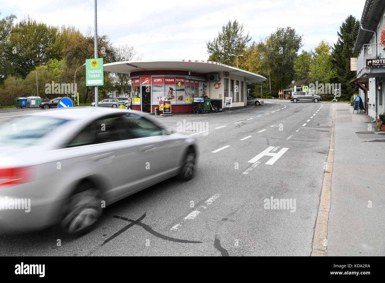A car passing next to the former border checkpoint just before the ...