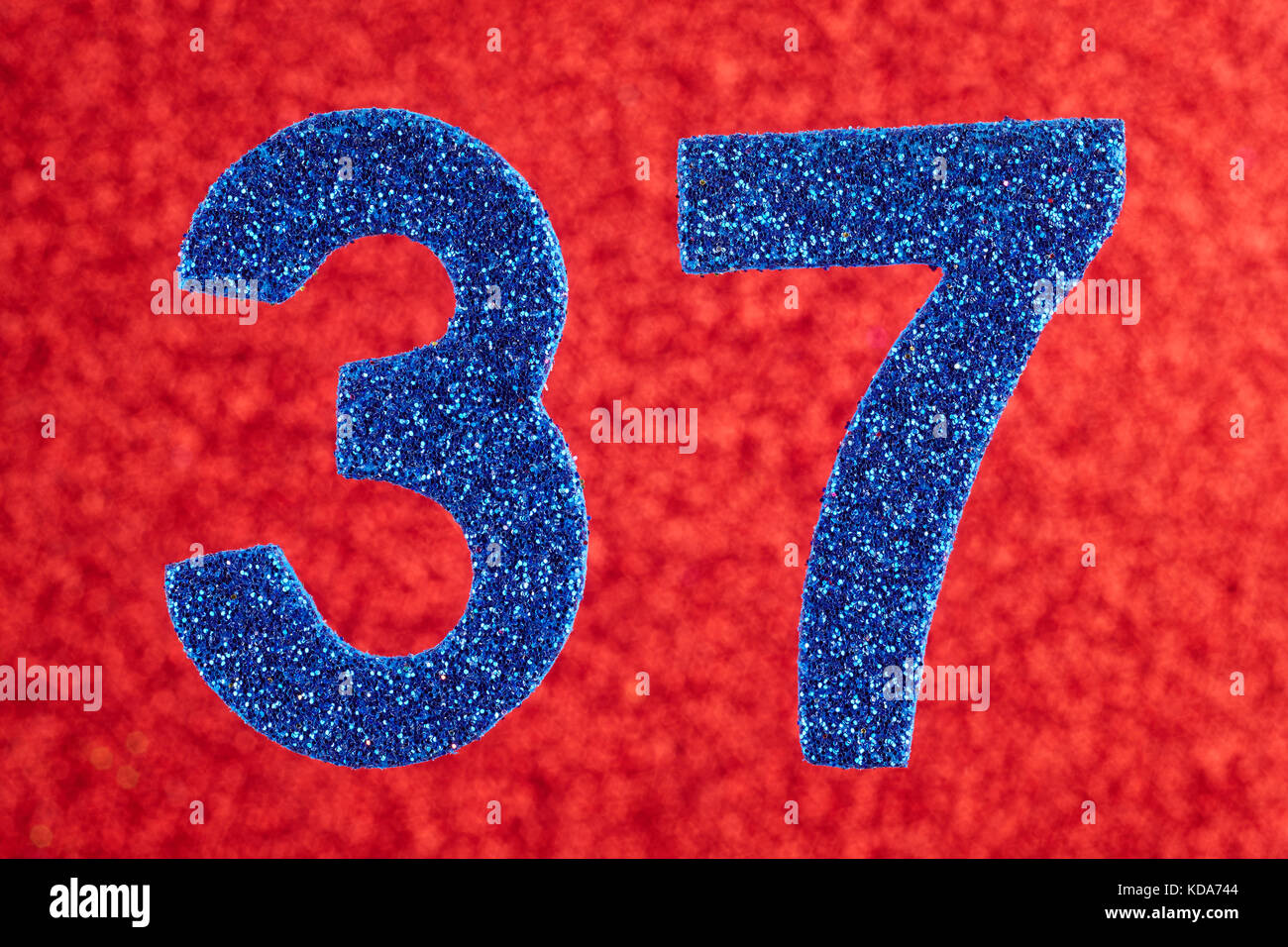 Number thirty-seven blue color over a red background. Anniversary ...
