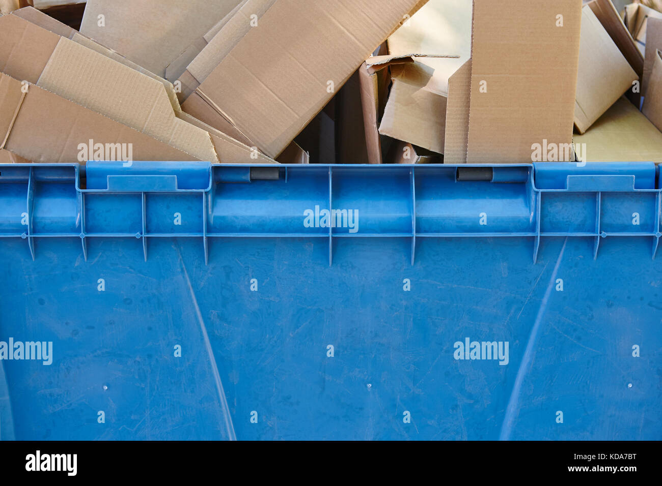 Blue recycling container for paper with cardboard boxes. Environment ...