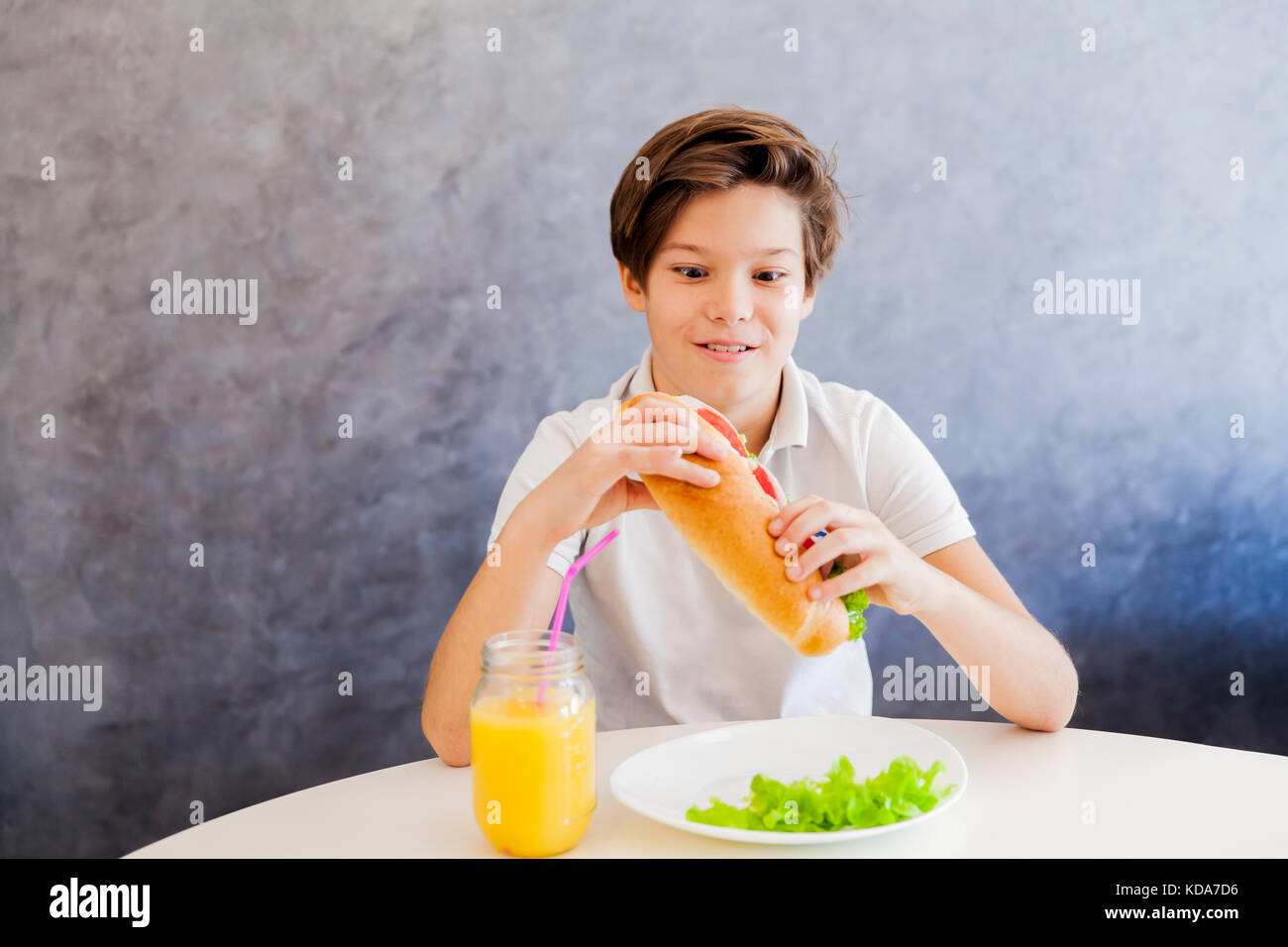 Portrait of cute teen boy having healthy breakfast at home Stock Photo ...