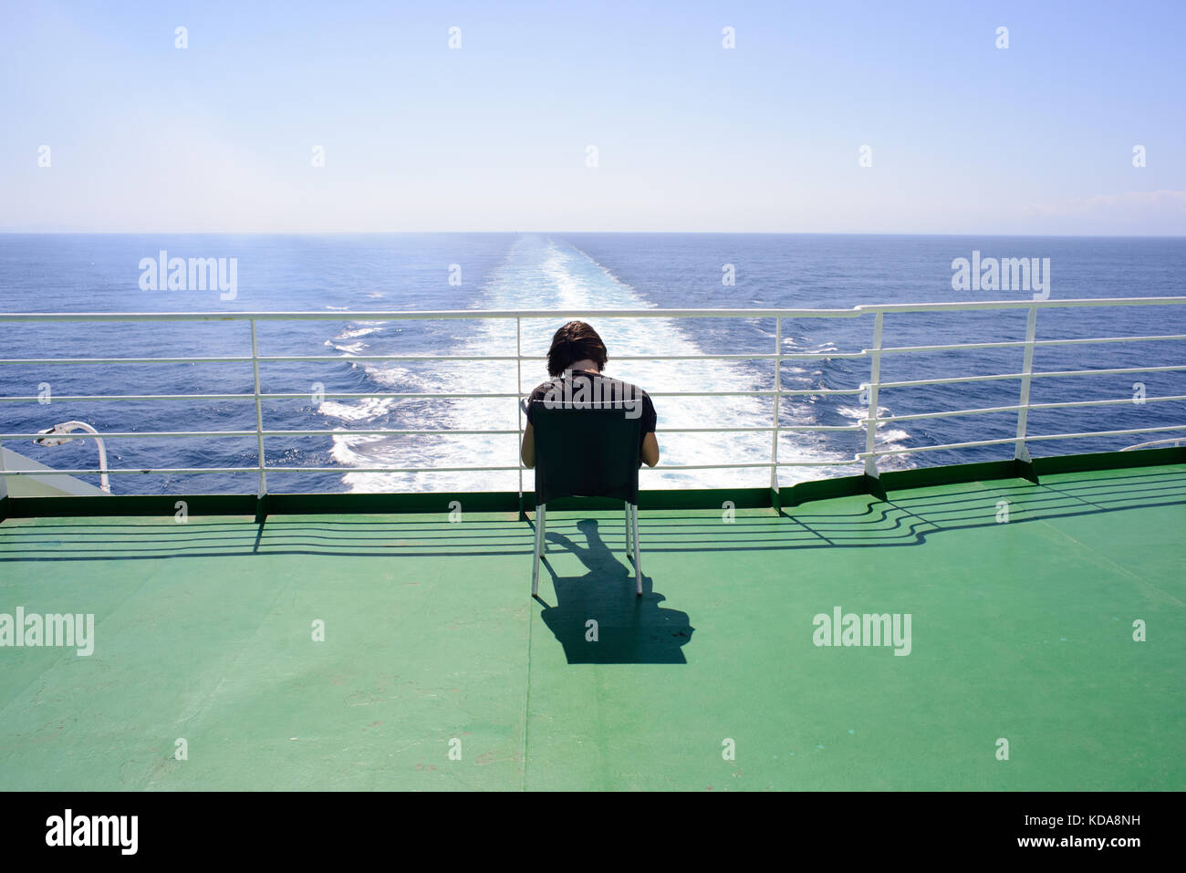 Man sitting chair sea hi-res stock photography and images - Alamy