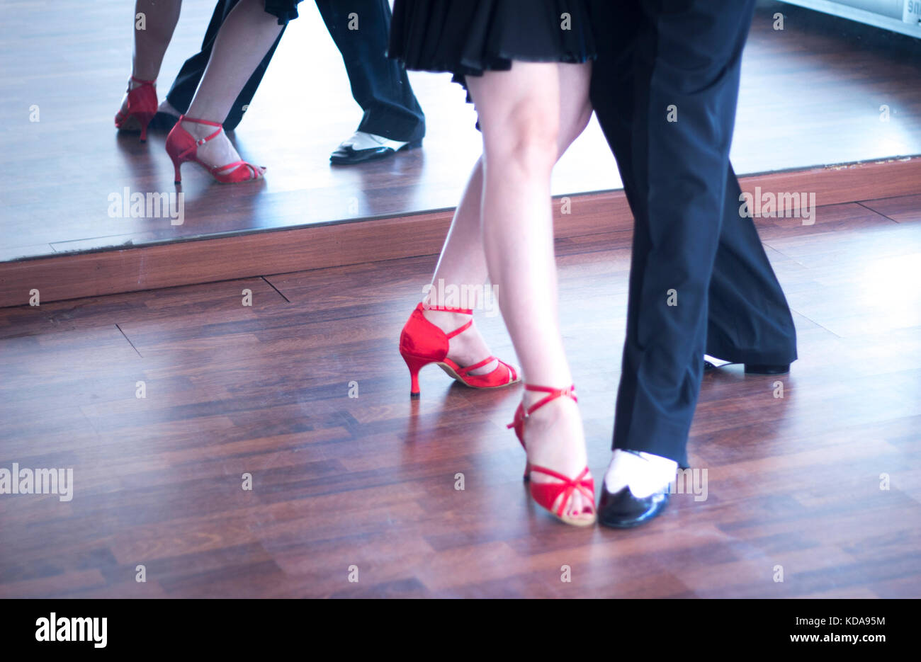 Ballroom dance couple of dancers and teachers in studio school dancing ...