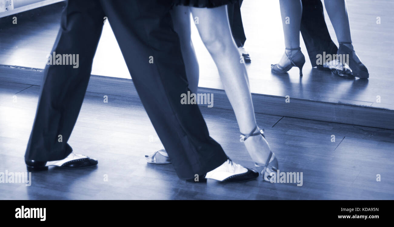 Ballroom dance couple of dancers and teachers in studio school dancing ...