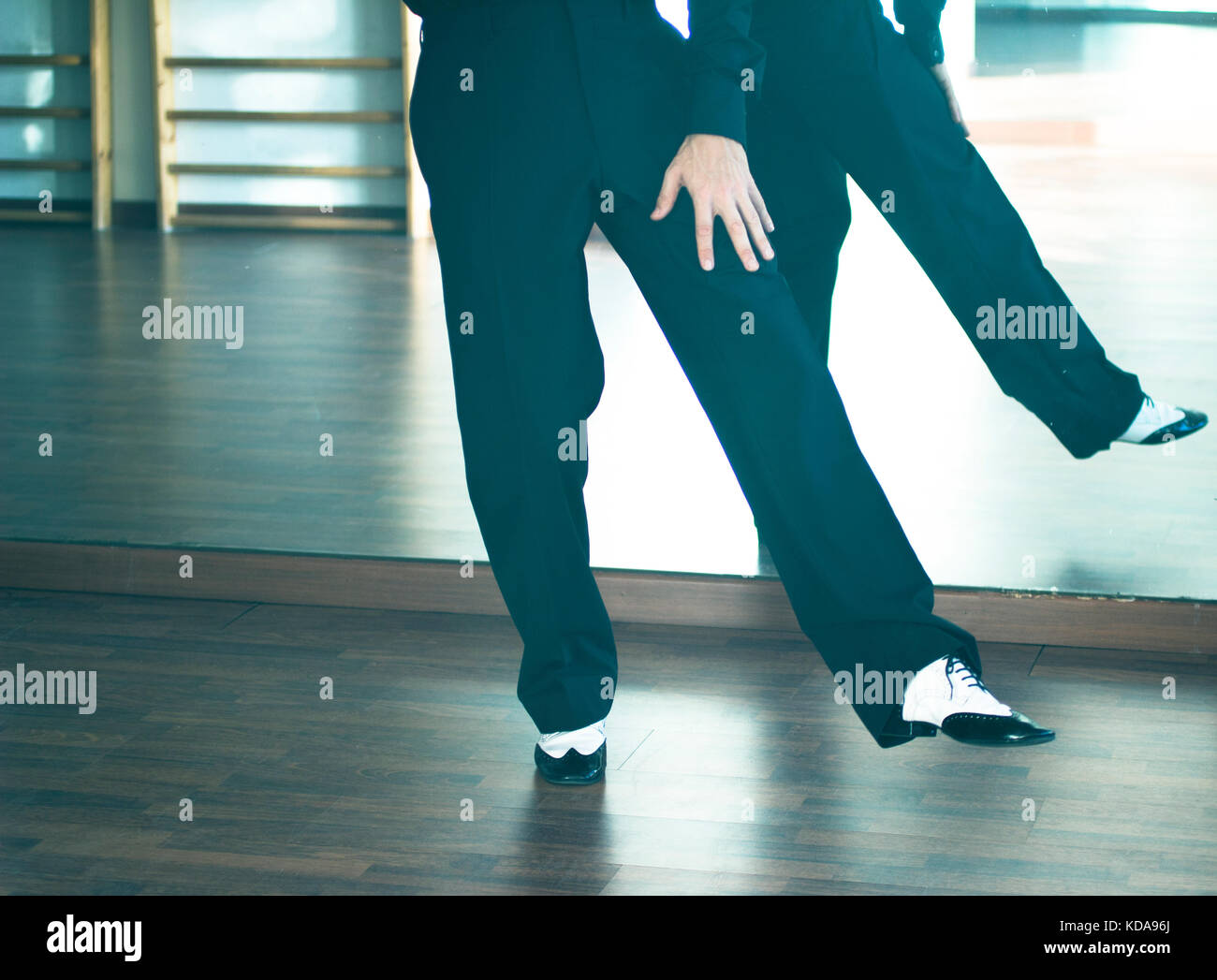 Ballroom dance male dancer and teacher in studio school dancing in ...