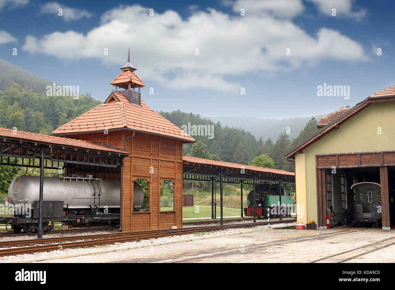 old railway station with steam locomotive Stock Photo - Alamy