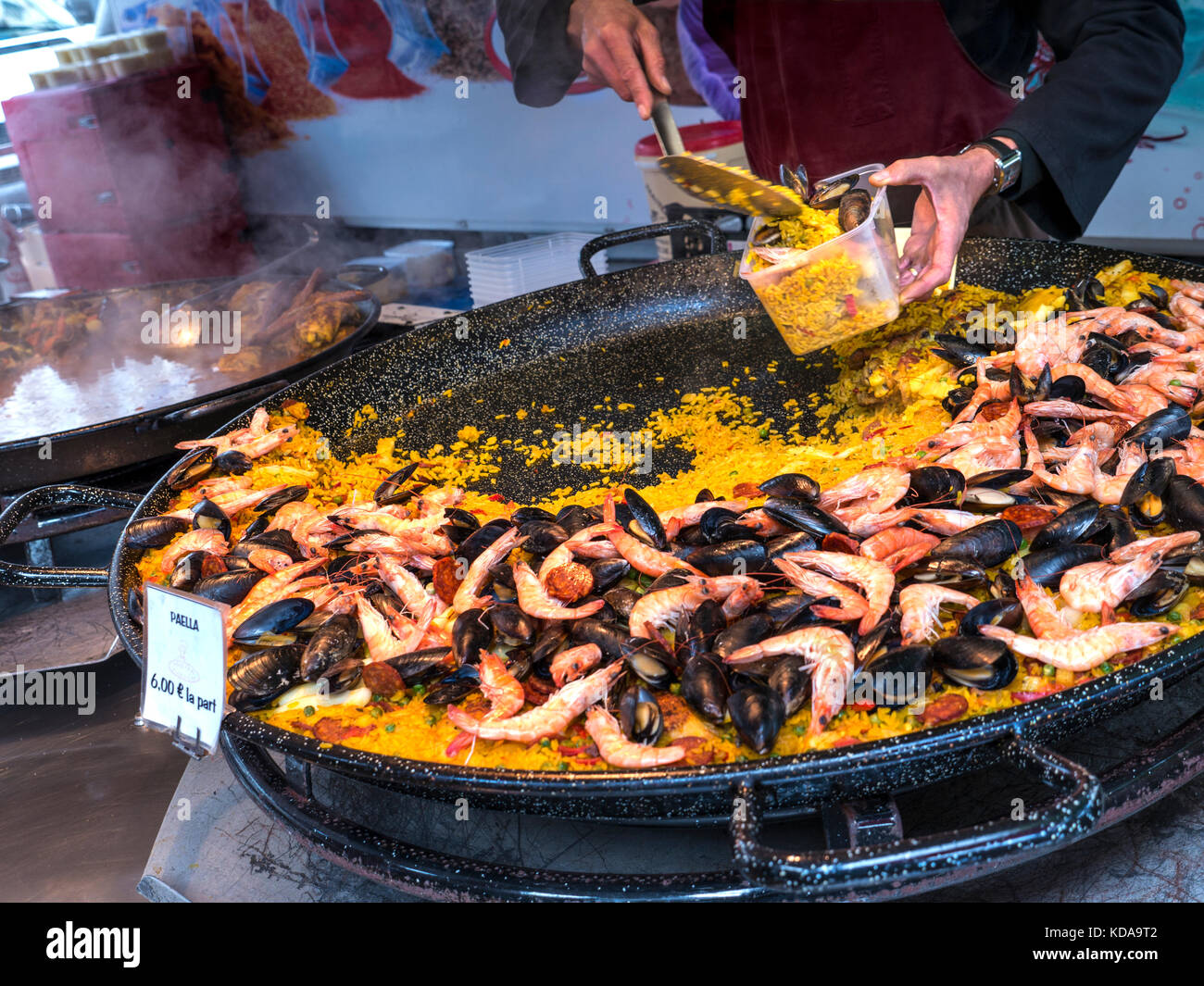 Spanish authentic Paella alfresco food stall with Paellera flat dish ...