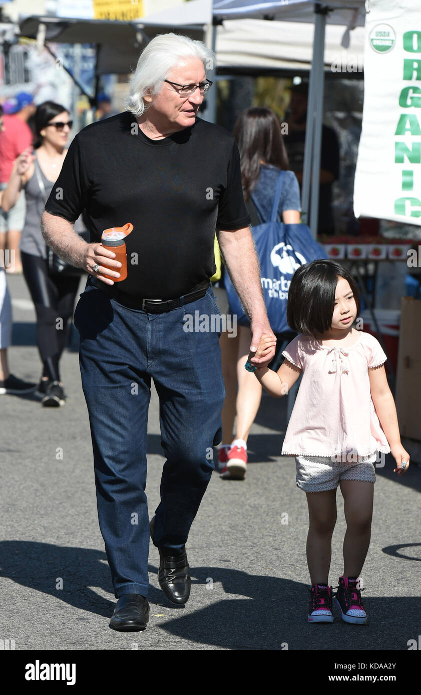 Tom Mesereau has fun with his daughter at the Studio City Farmers ...
