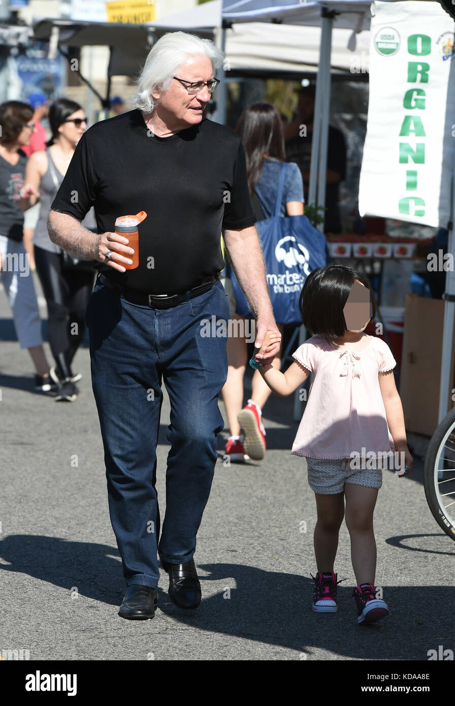 Tom Mesereau has fun with his daughter at the Studio City Farmers ...