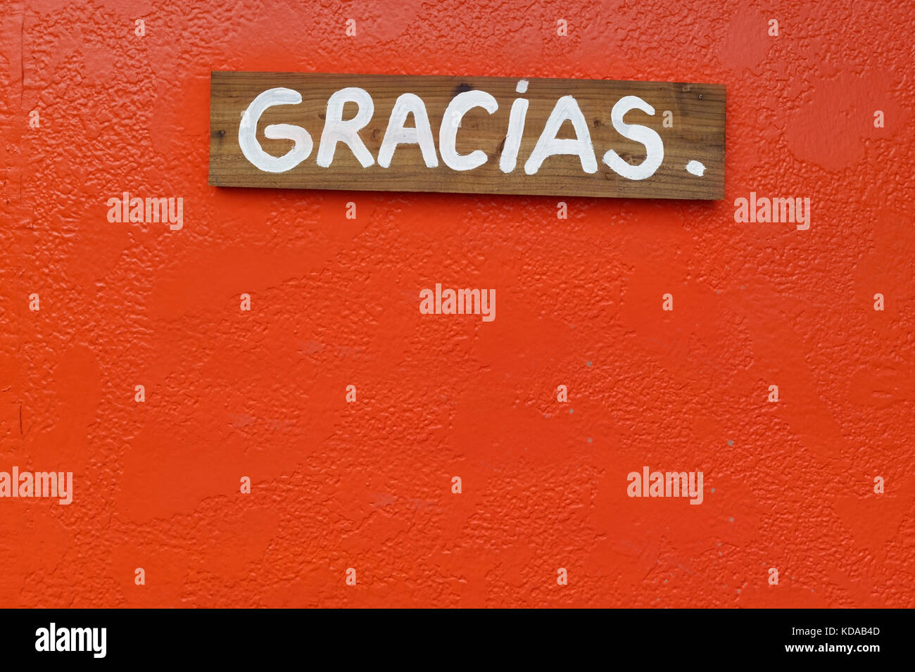 GRACIAS sign attached to orange wall. Copy space Stock Photo - Alamy