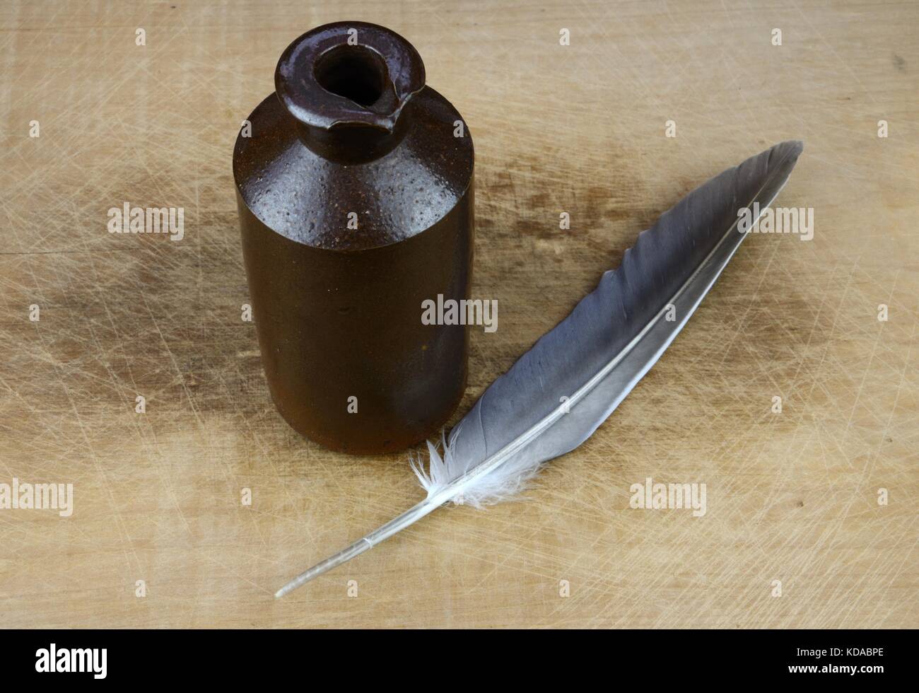 Vintage Stoneware Ink Bottle with Feather Quill Stock Photo - Alamy