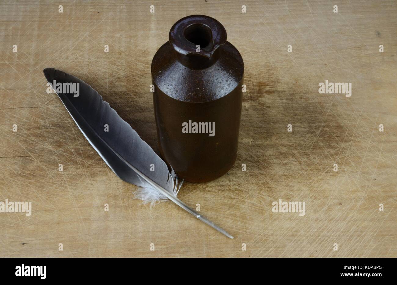 Vintage Stoneware Ink Bottle with Feather Quill Stock Photo - Alamy