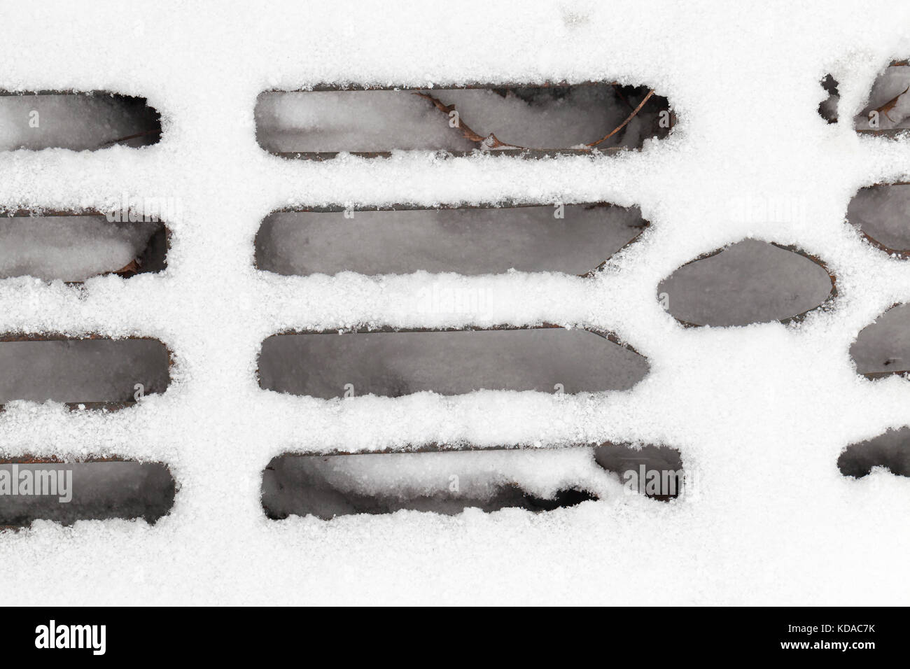 Grate under the snow Stock Photo - Alamy