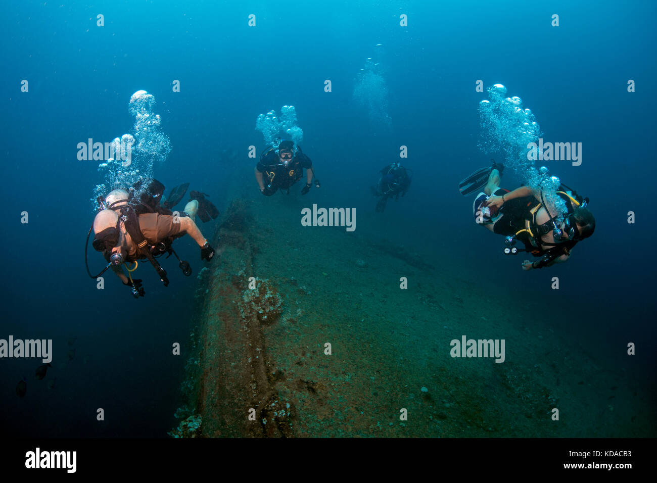 U.S. Navy sailors scuba dive at the American Tanker wreck near Naval ...