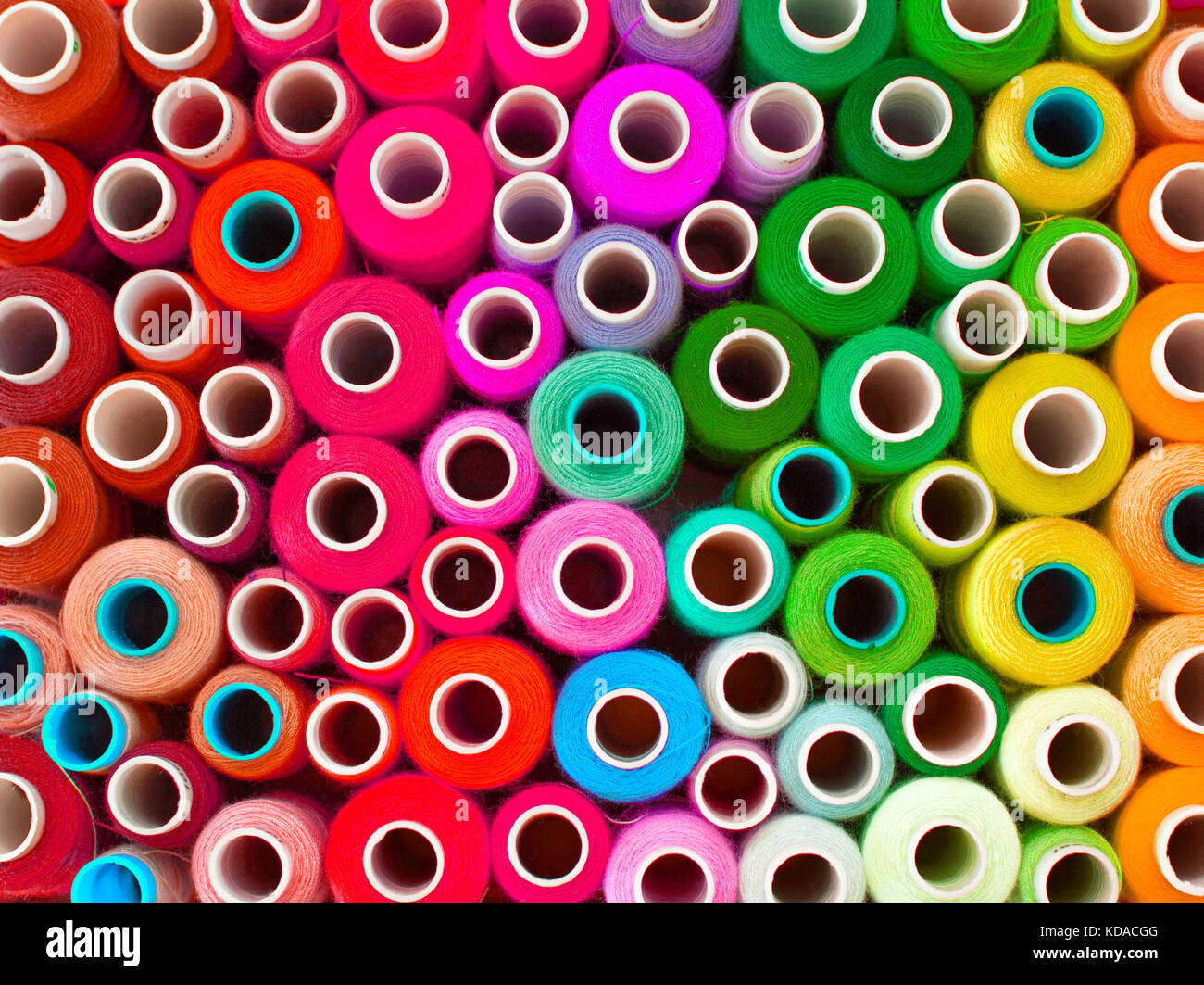 Colored thread for sewing. Threads in spools tape measure, needle bar ...